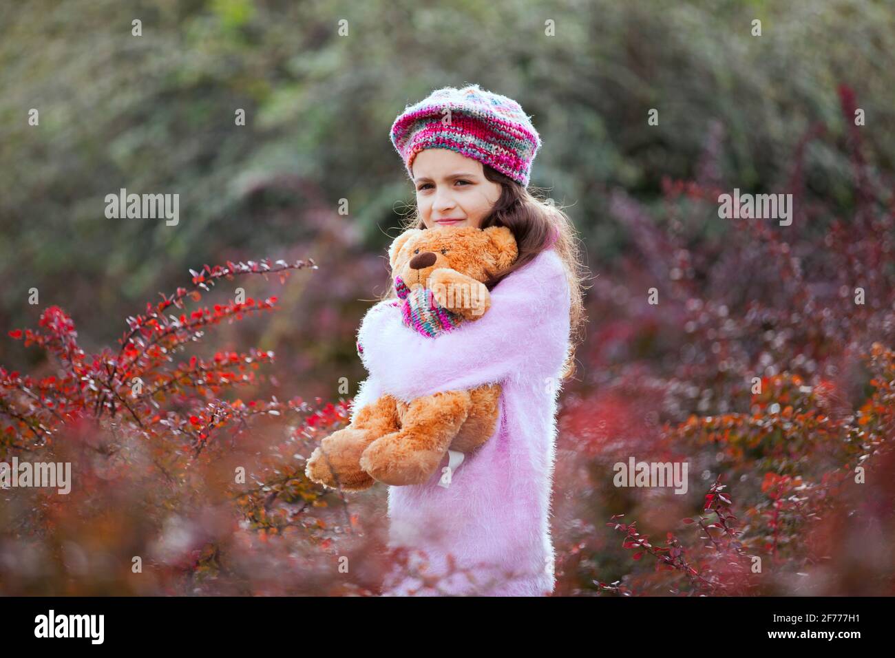 Female child hugging her teddy bear Stock Photo - Alamy