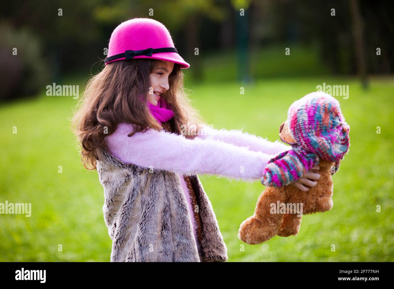 Female child hugging her teddy bear Stock Photo - Alamy