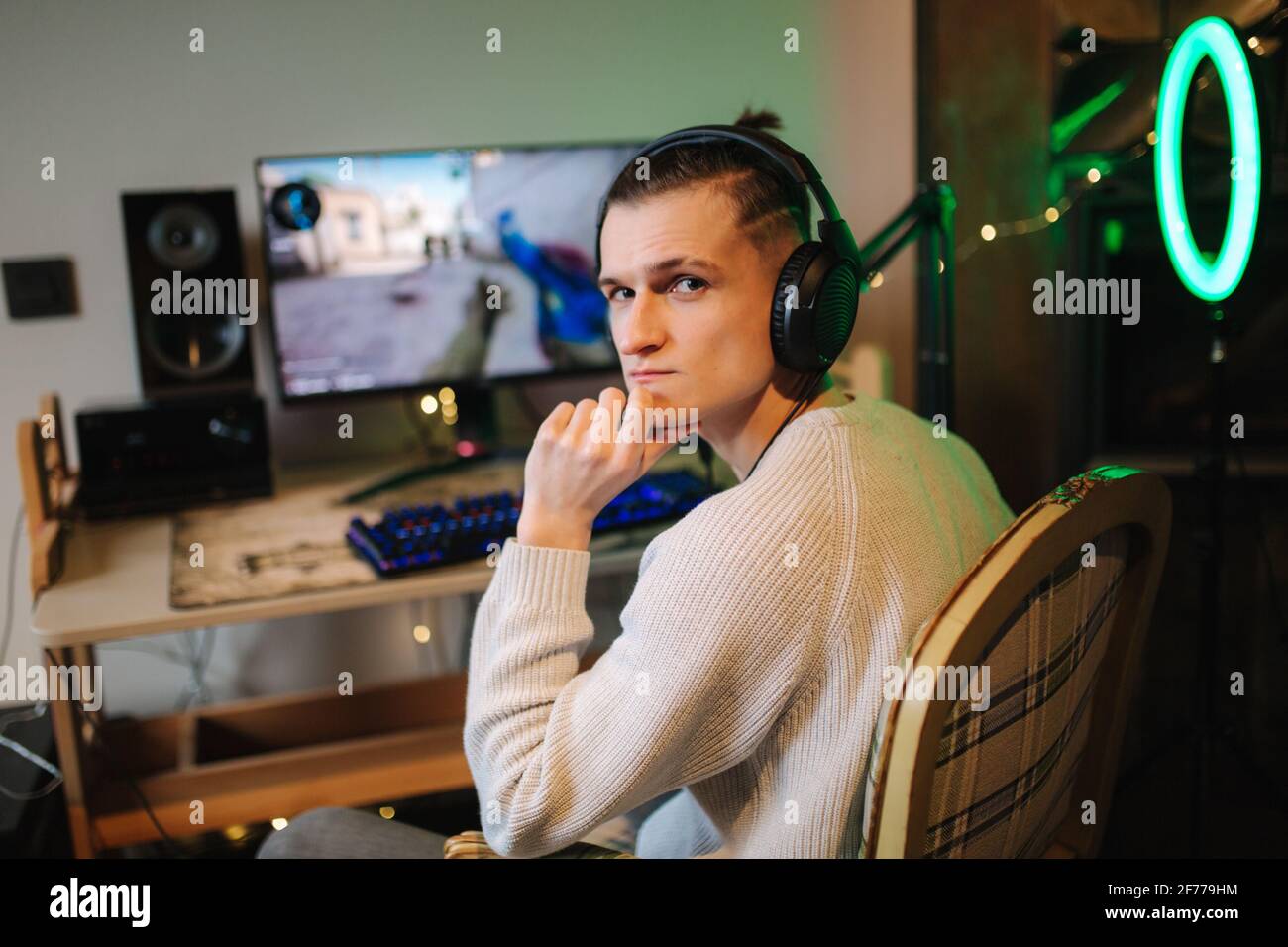 Men playing online video games at home using powerful computer ...