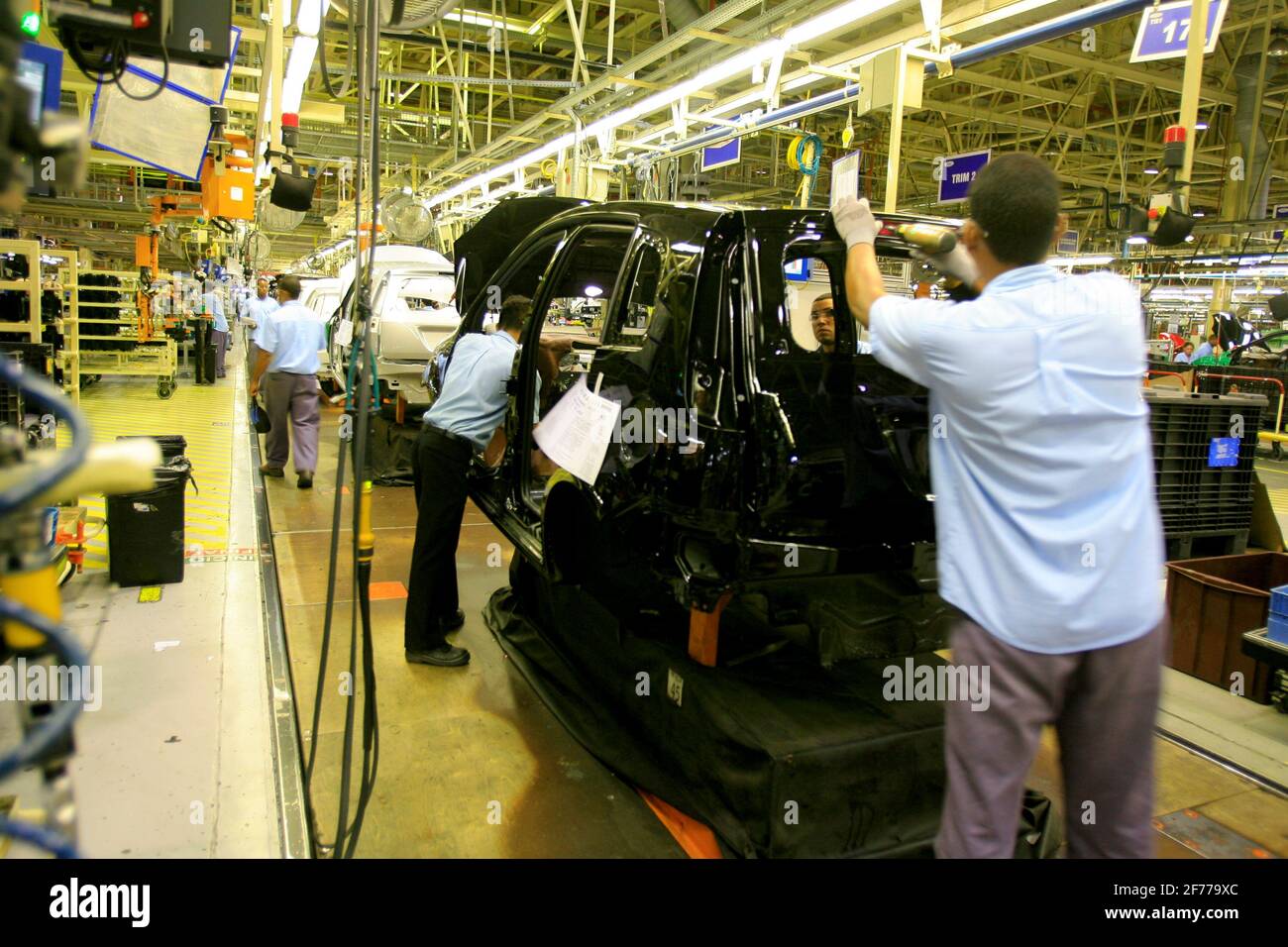 salvador, bahia / brazil - december 12, 2013: employees are seen at ...