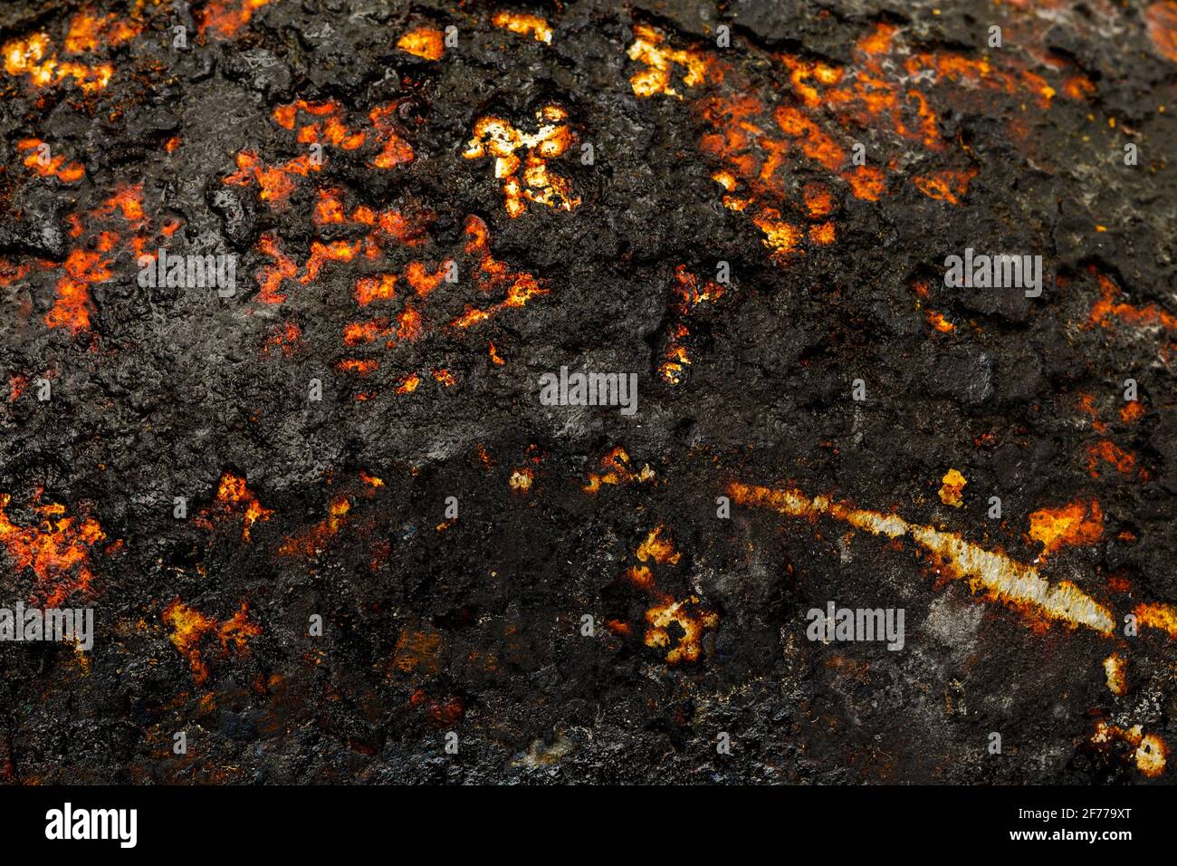 Bottom side of a cast iron pan with thicl layer of soot on it Stock ...