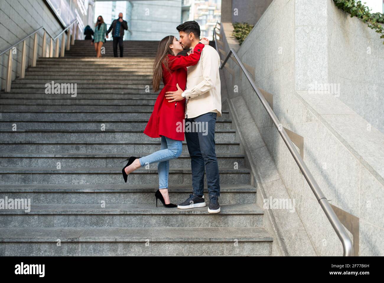 Couple kissing stairs hi-res stock photography and images - Alamy
