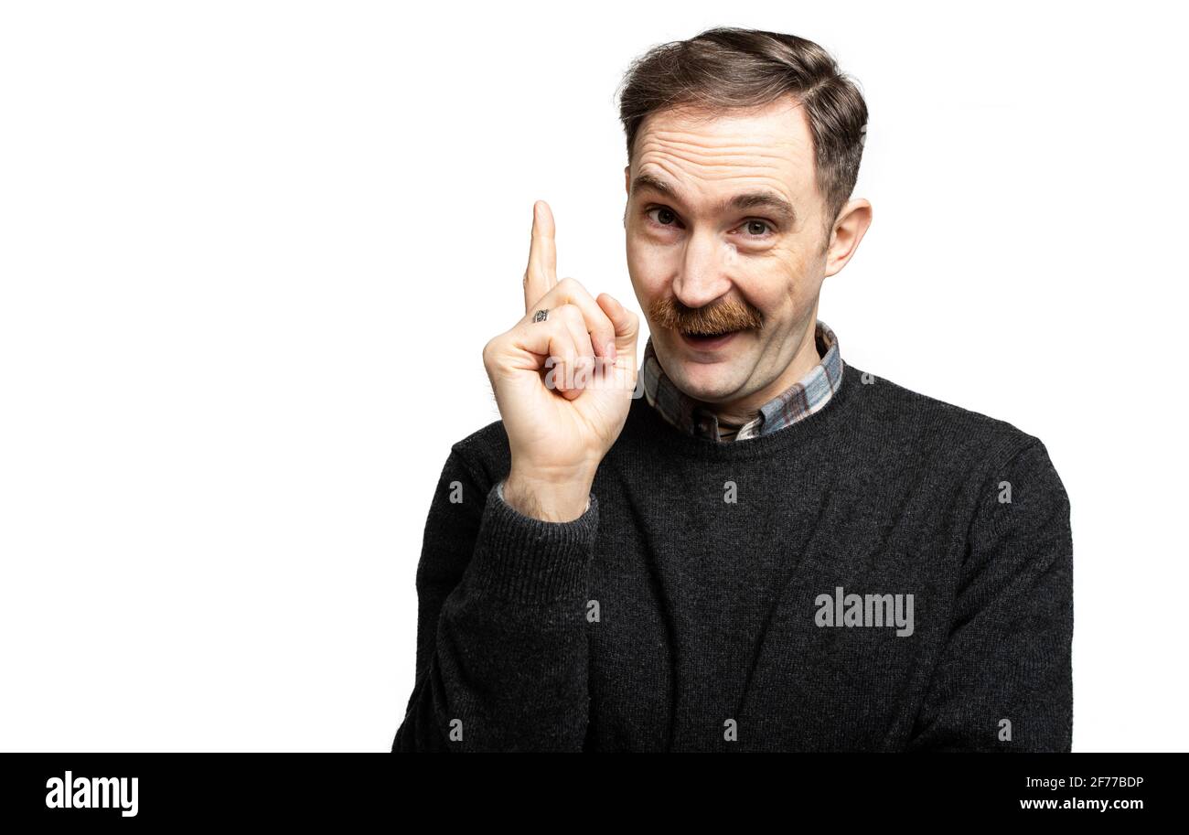 Man pointing his finger up having an idea Stock Photo - Alamy