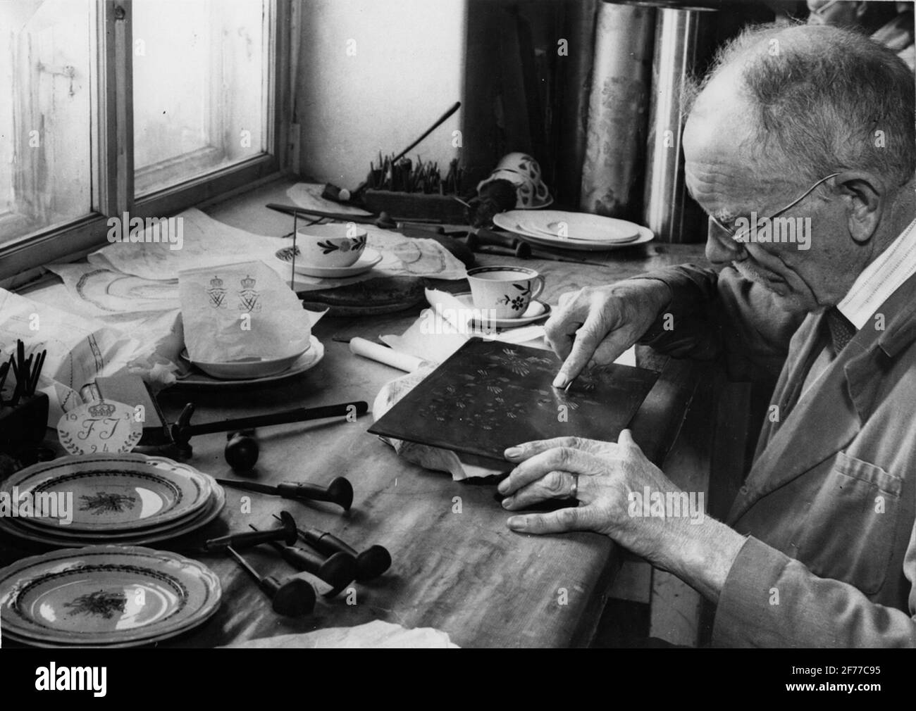 Gustavsberg's porcelain factory. Etching of name chiffery plates Stock ...