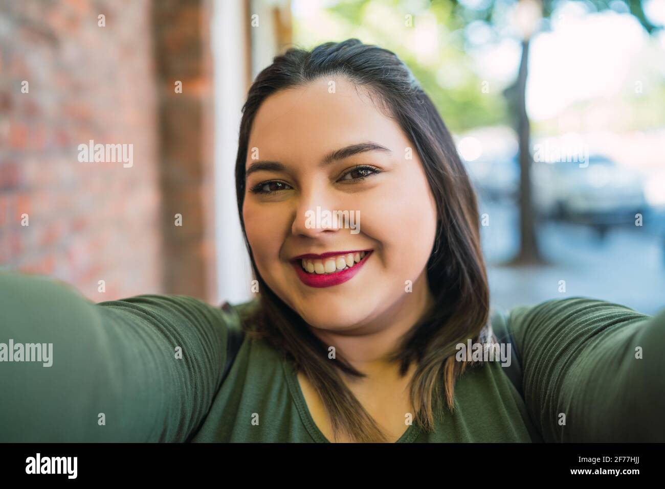 Happy young curvy woman hi-res stock photography and images - Alamy