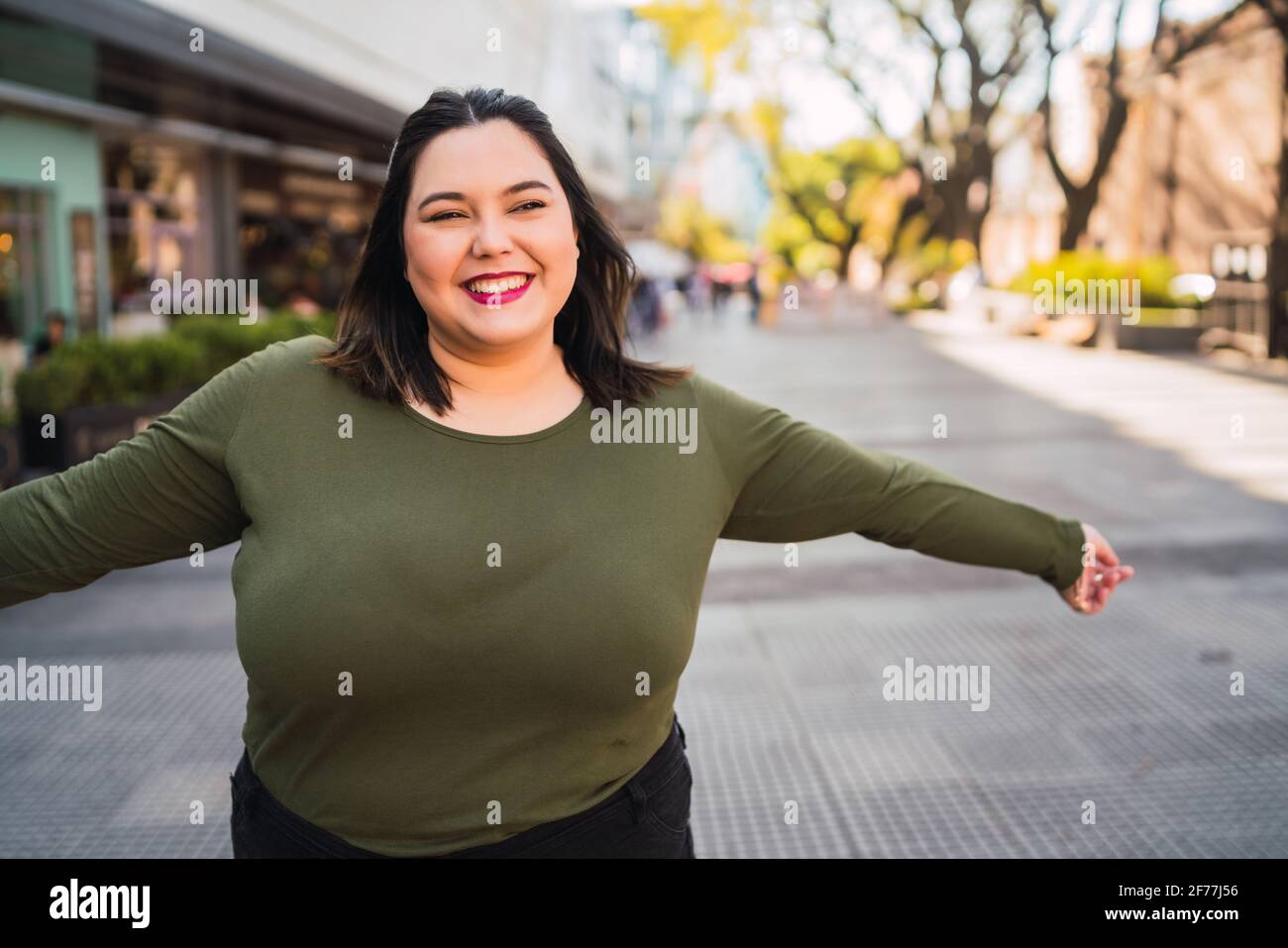 Portrait of young plus size woman Stock Photo - Alamy