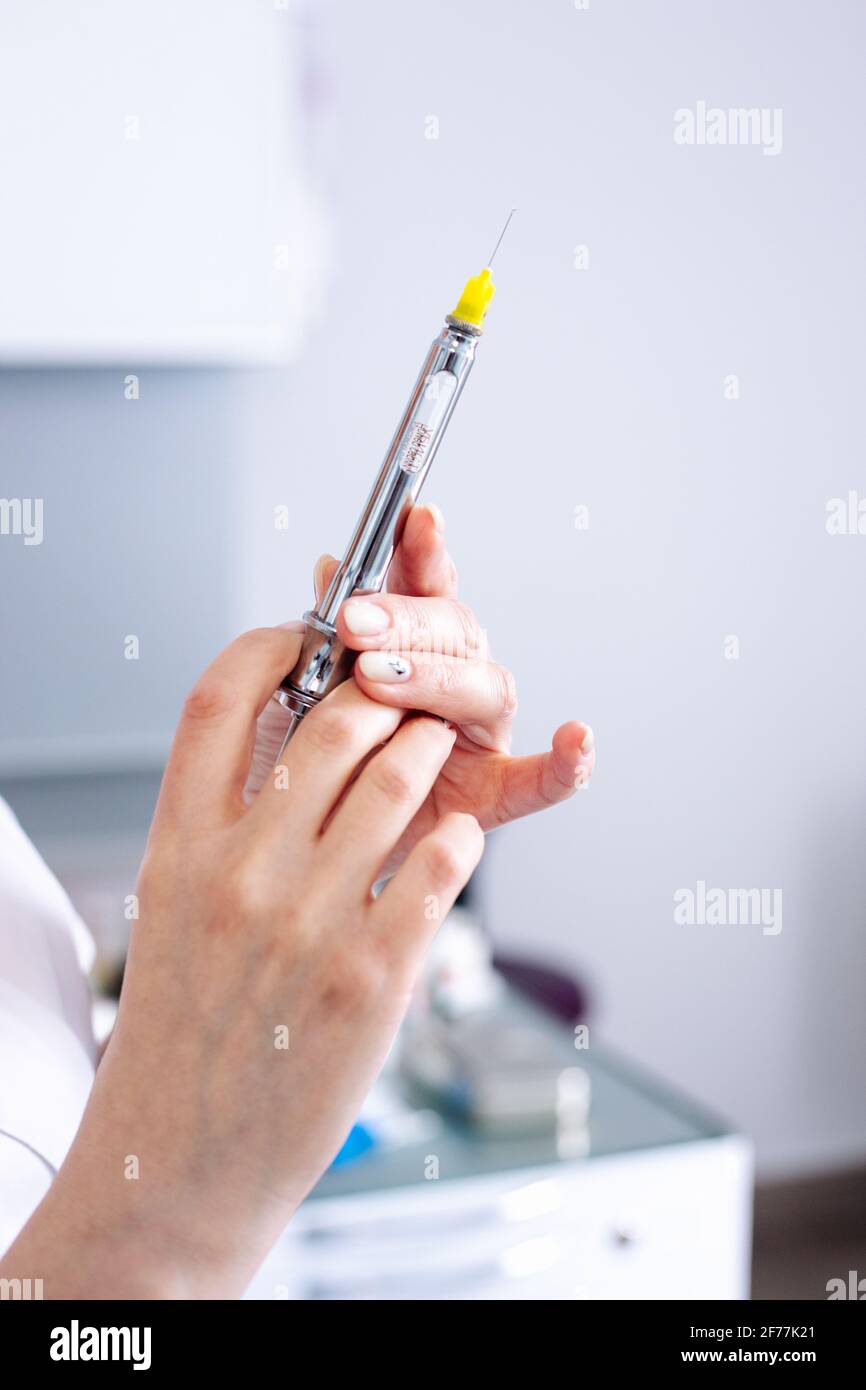 Female hands with a syringe for injection. Vaccination Stock Photo - Alamy
