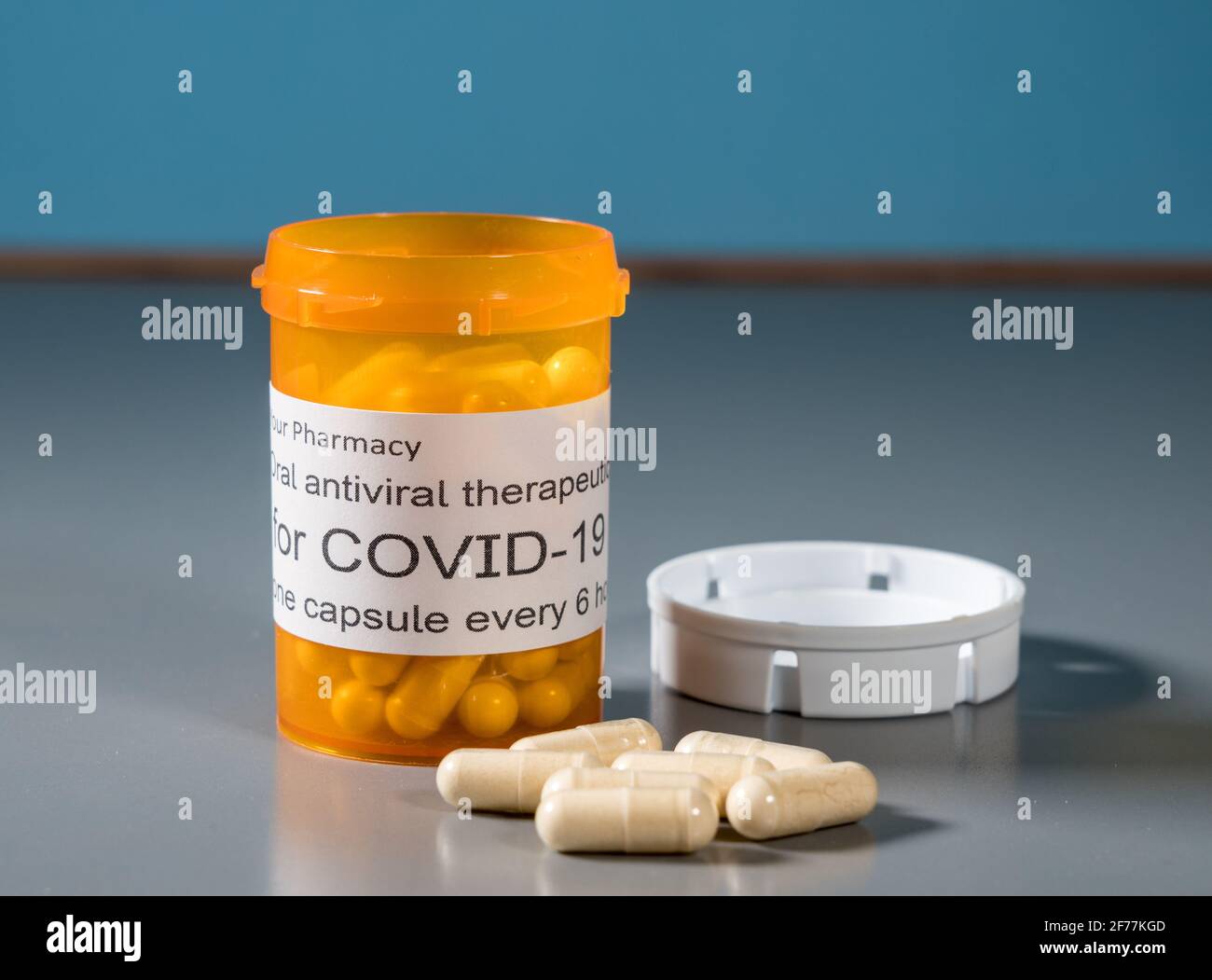 Prescription bottle and capsules illustrating trials of oral antiviral ...