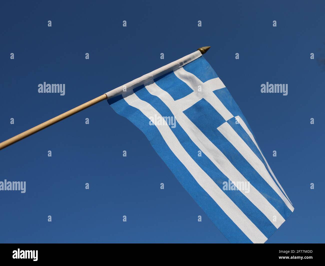 Greek Flag Flying over a blue sky Stock Photo - Alamy