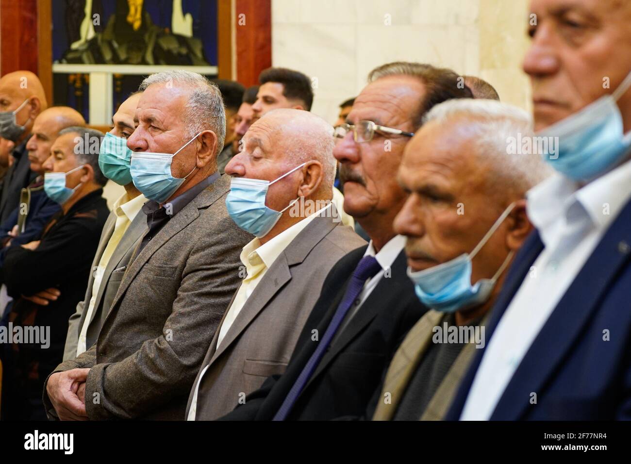 Iraqi Christians attend the Easter mass at the Grand Immaculate Church ...