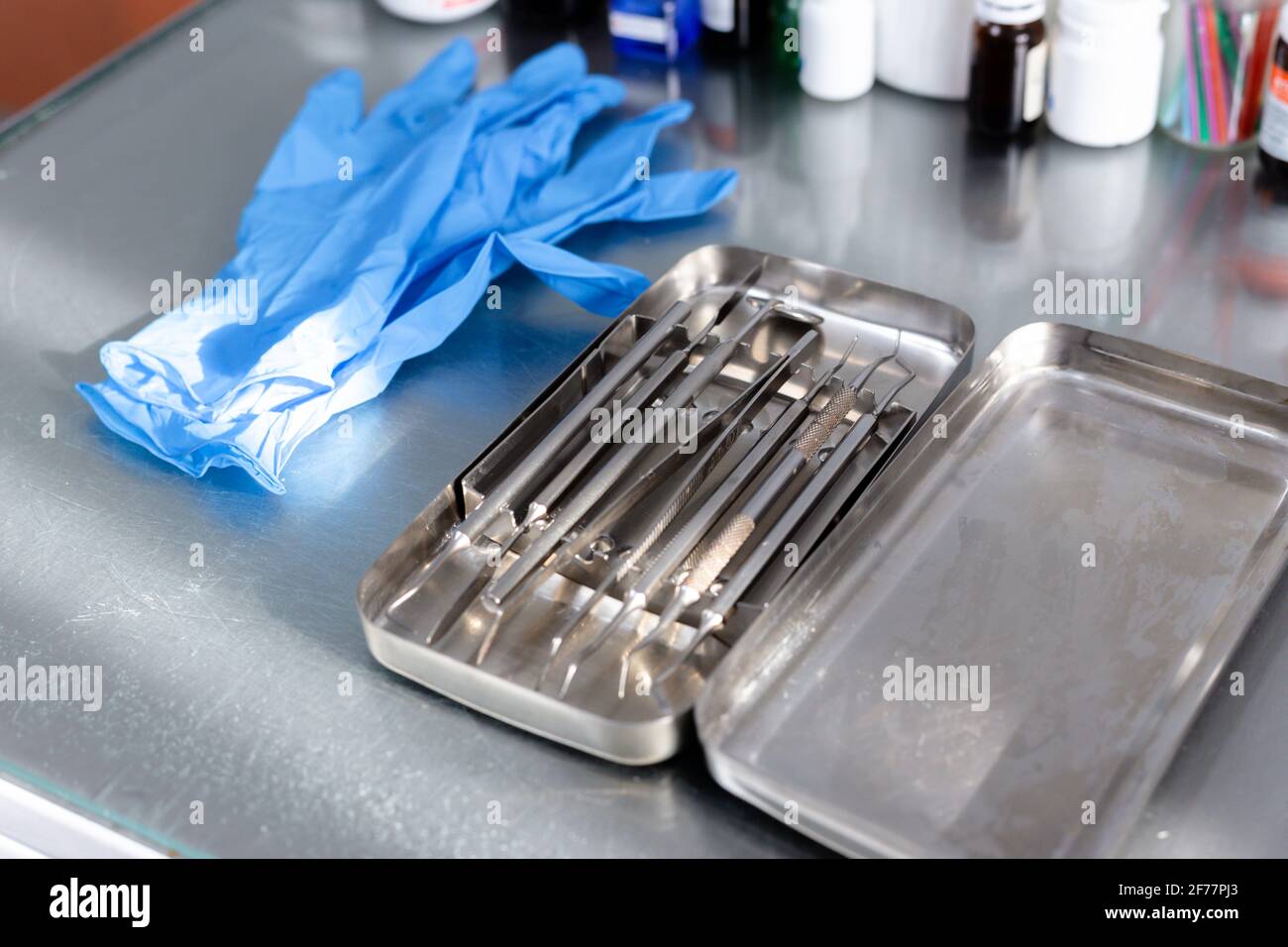 Dental instruments and medical gloves on the table Stock Photo - Alamy