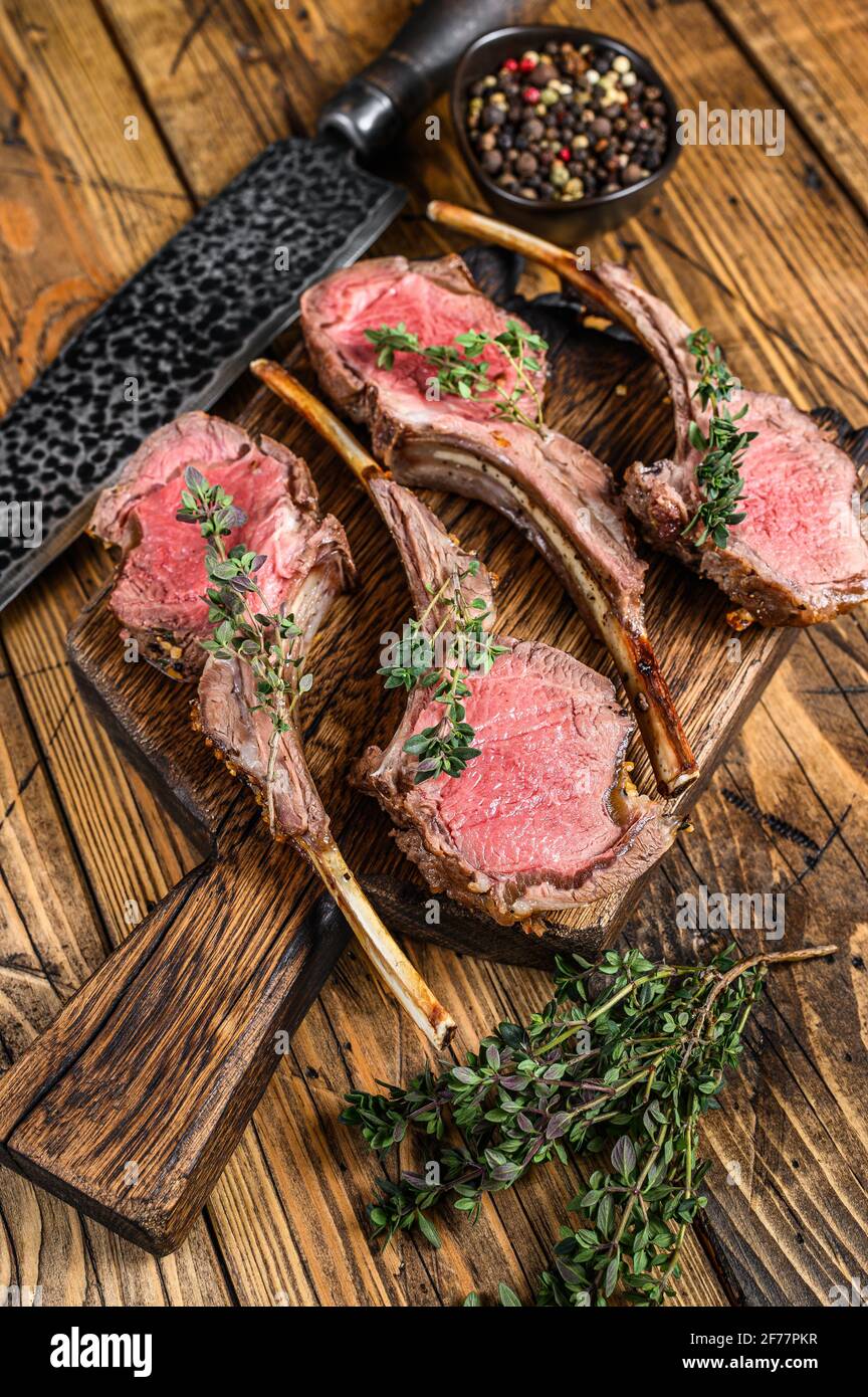Grilled lamb rib chop steaks. wooden background. Top view Stock Photo ...