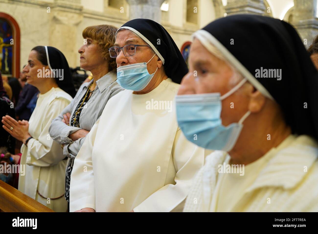 Iraqi Christians attend the Easter mass at the Grand Immaculate Church ...
