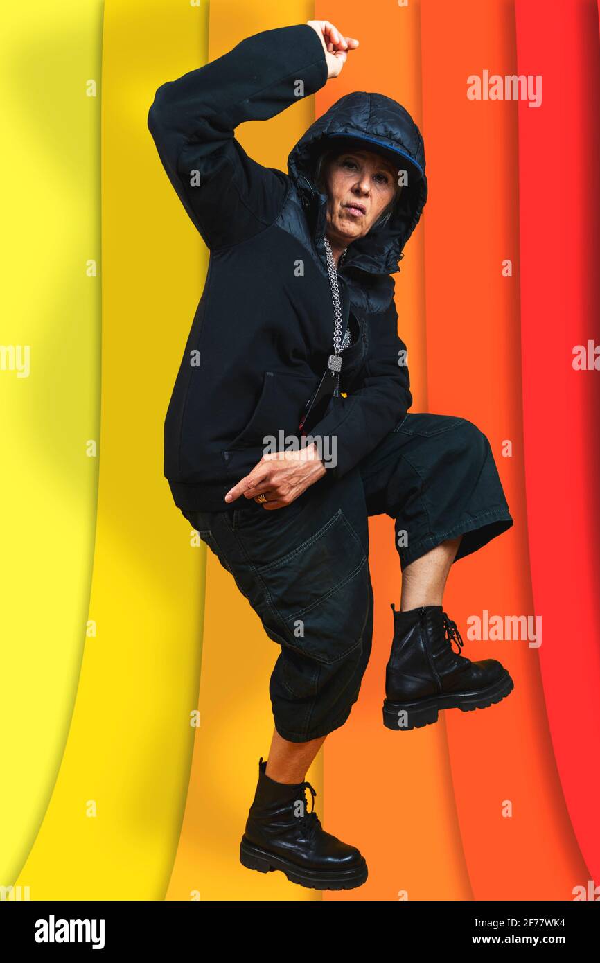 Funny portrait of mature woman. Lady having fun dressed as an angry ...