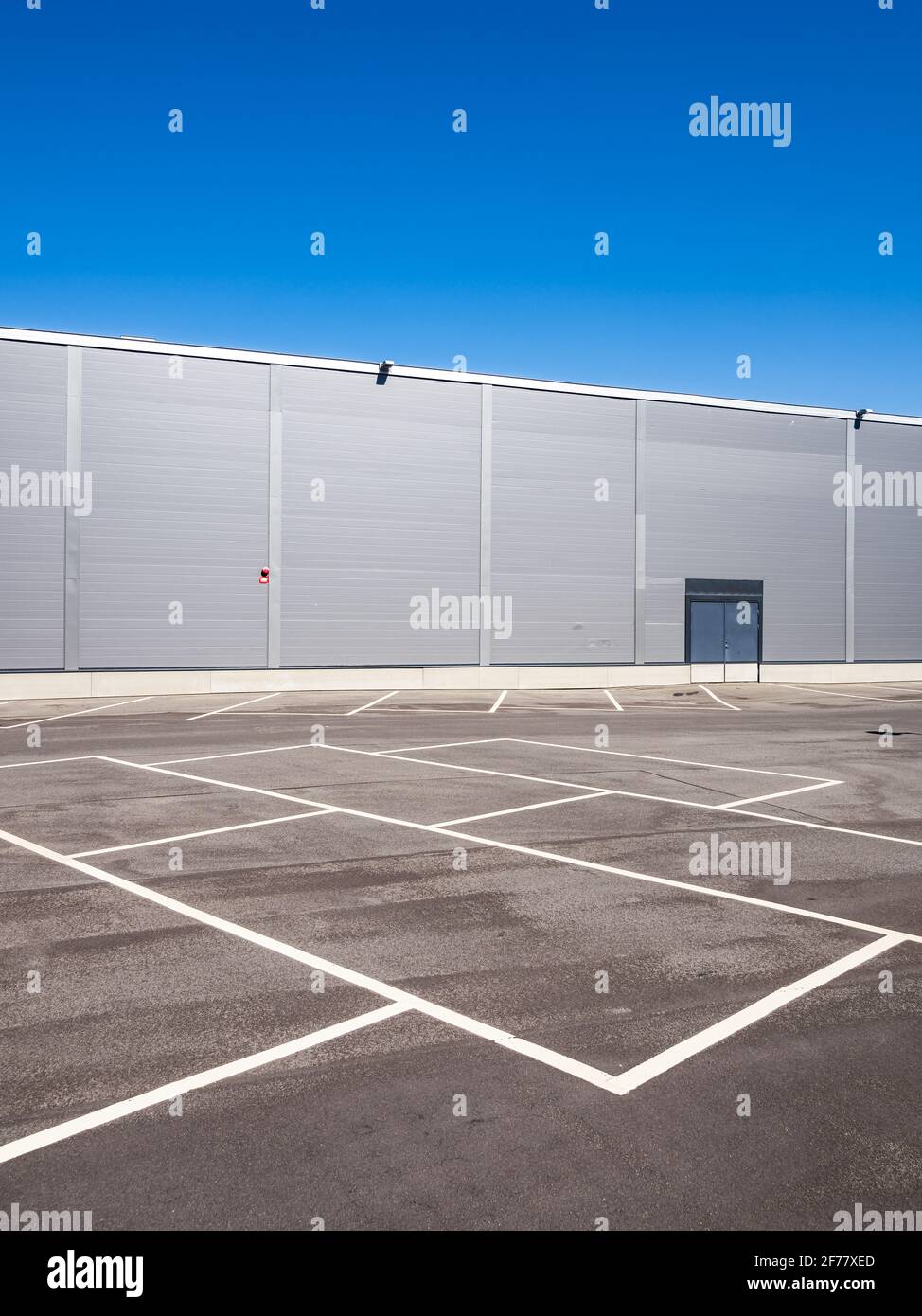 Empty parking in front of an aluminium cladding modern building Stock ...