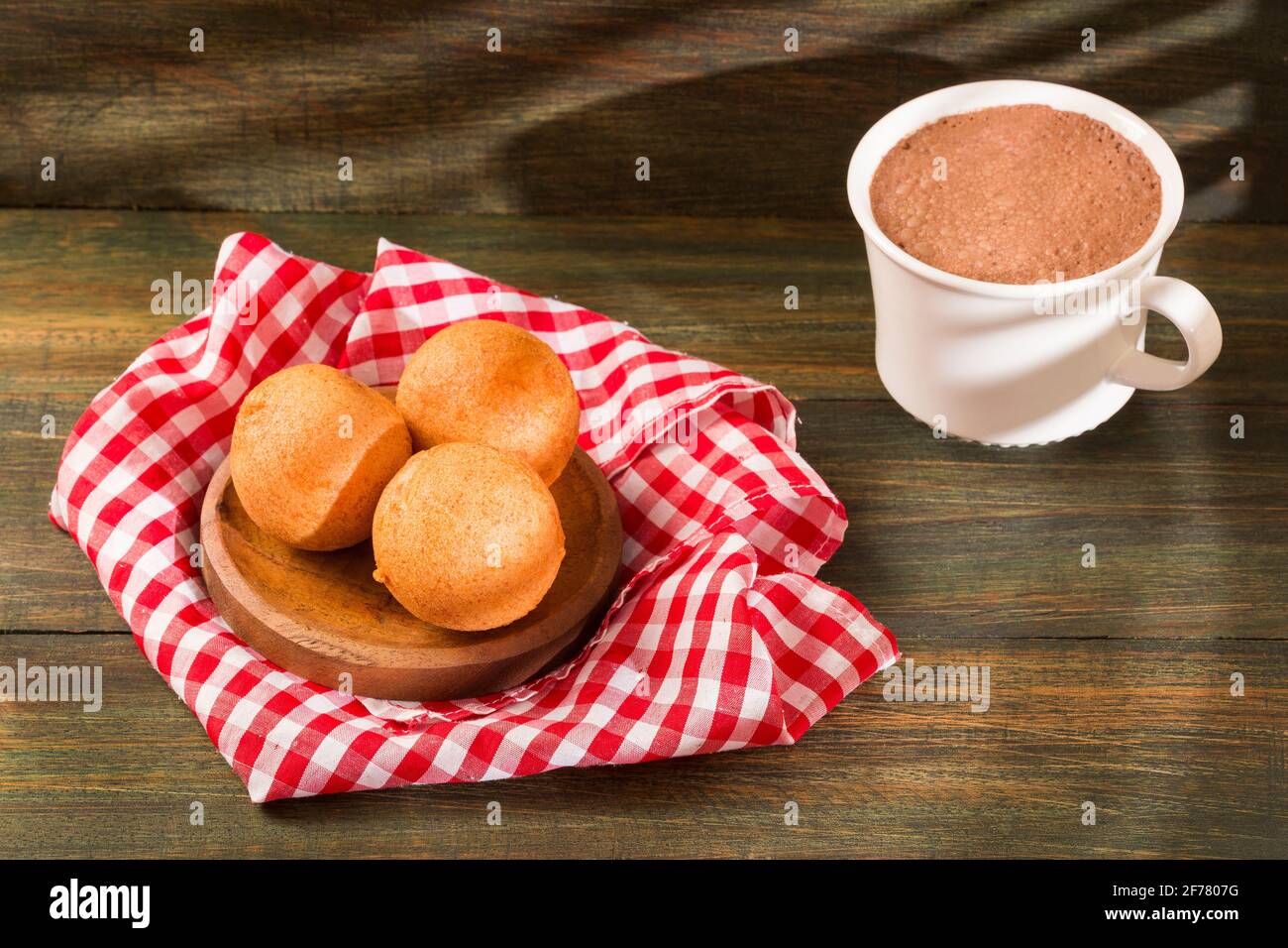 Traditional Colombian buñuelo - Deep Fried Cheese Bread. Hot chocolate ...