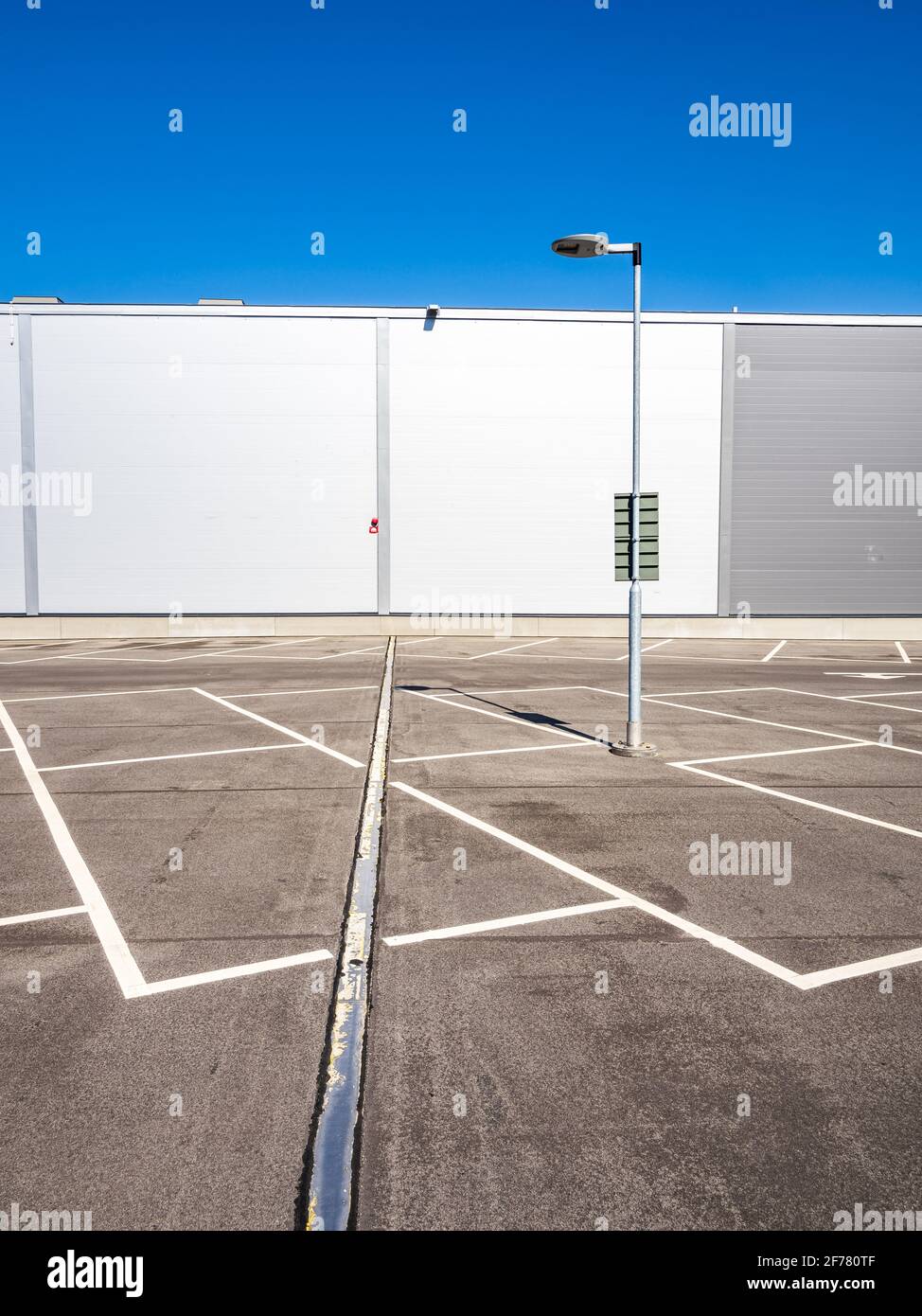 Empty parking in front of an aluminium cladding modern building Stock ...