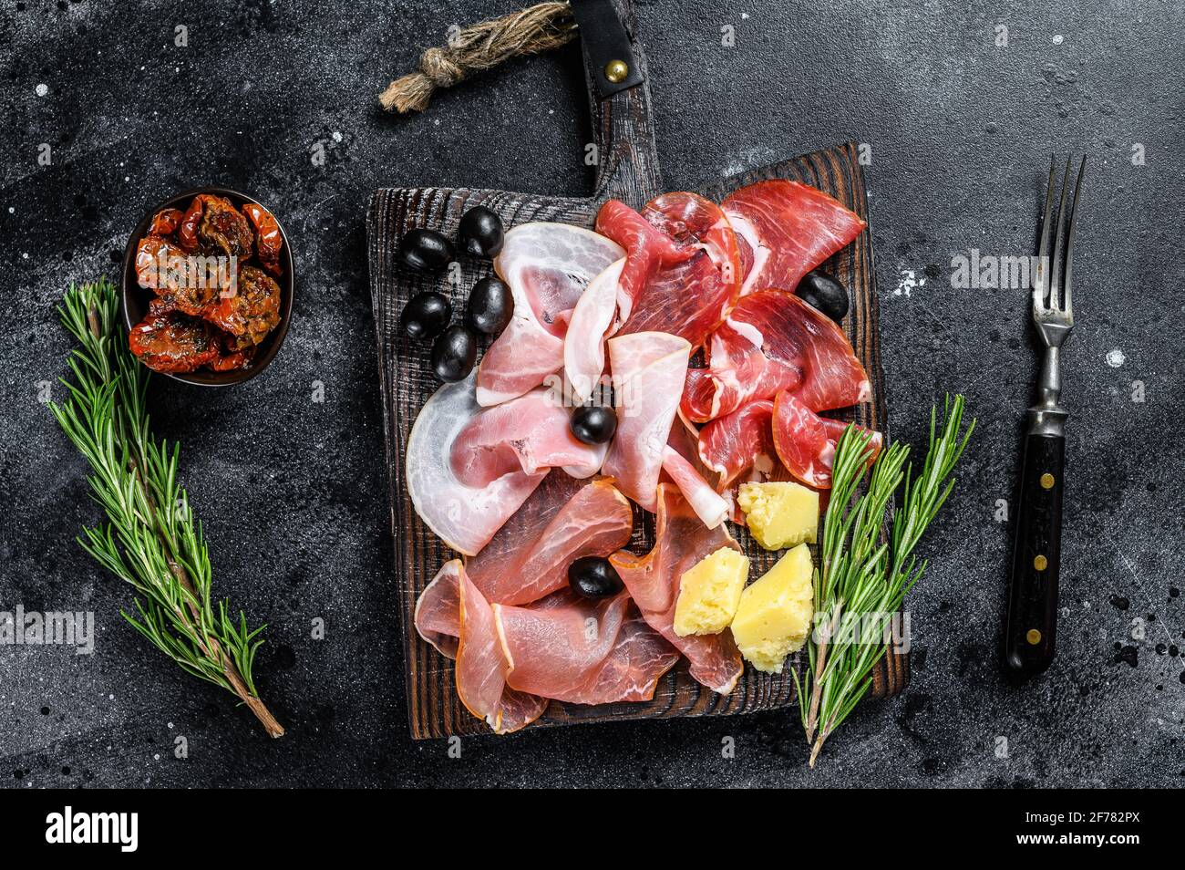 Set of smoked and dried meat Ham, jerky, salted meat, jamon and herbs ...