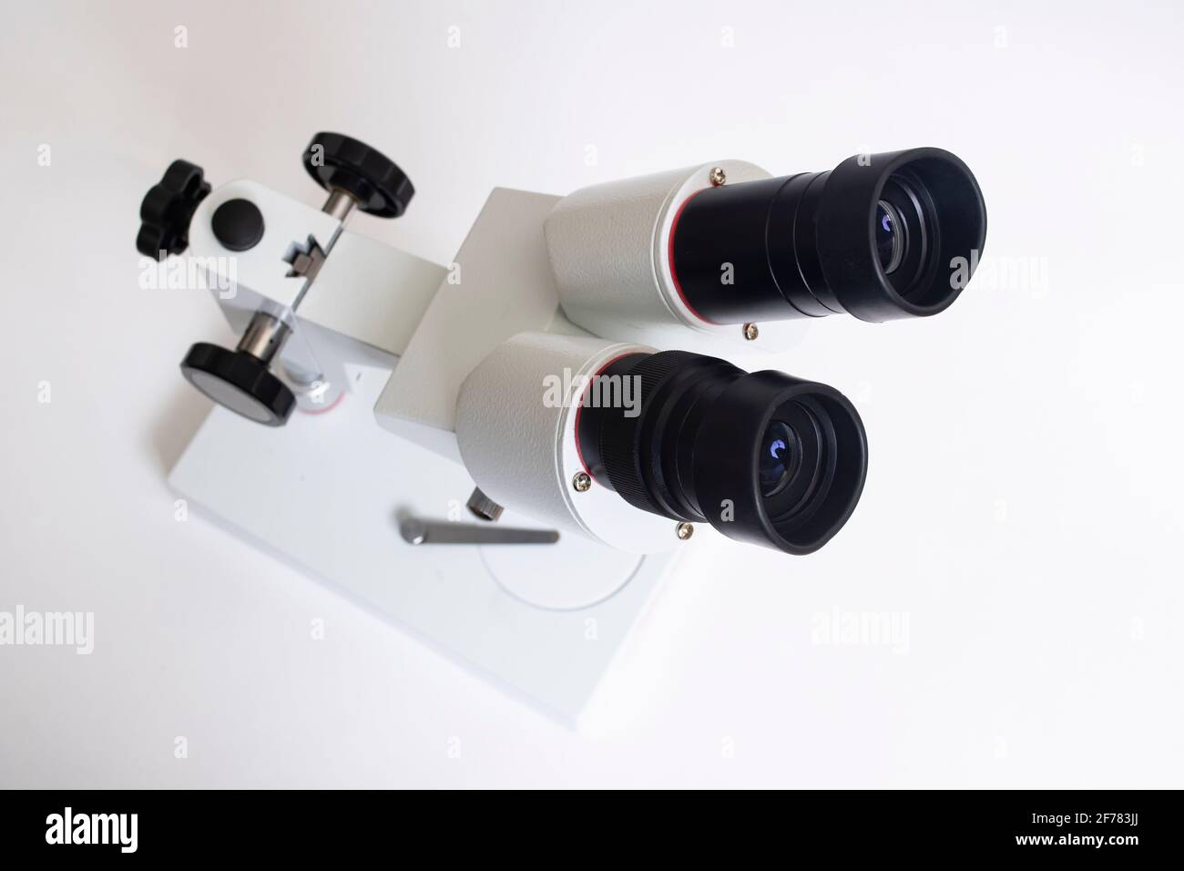 Gray medical microscope on a white background top view Stock Photo - Alamy