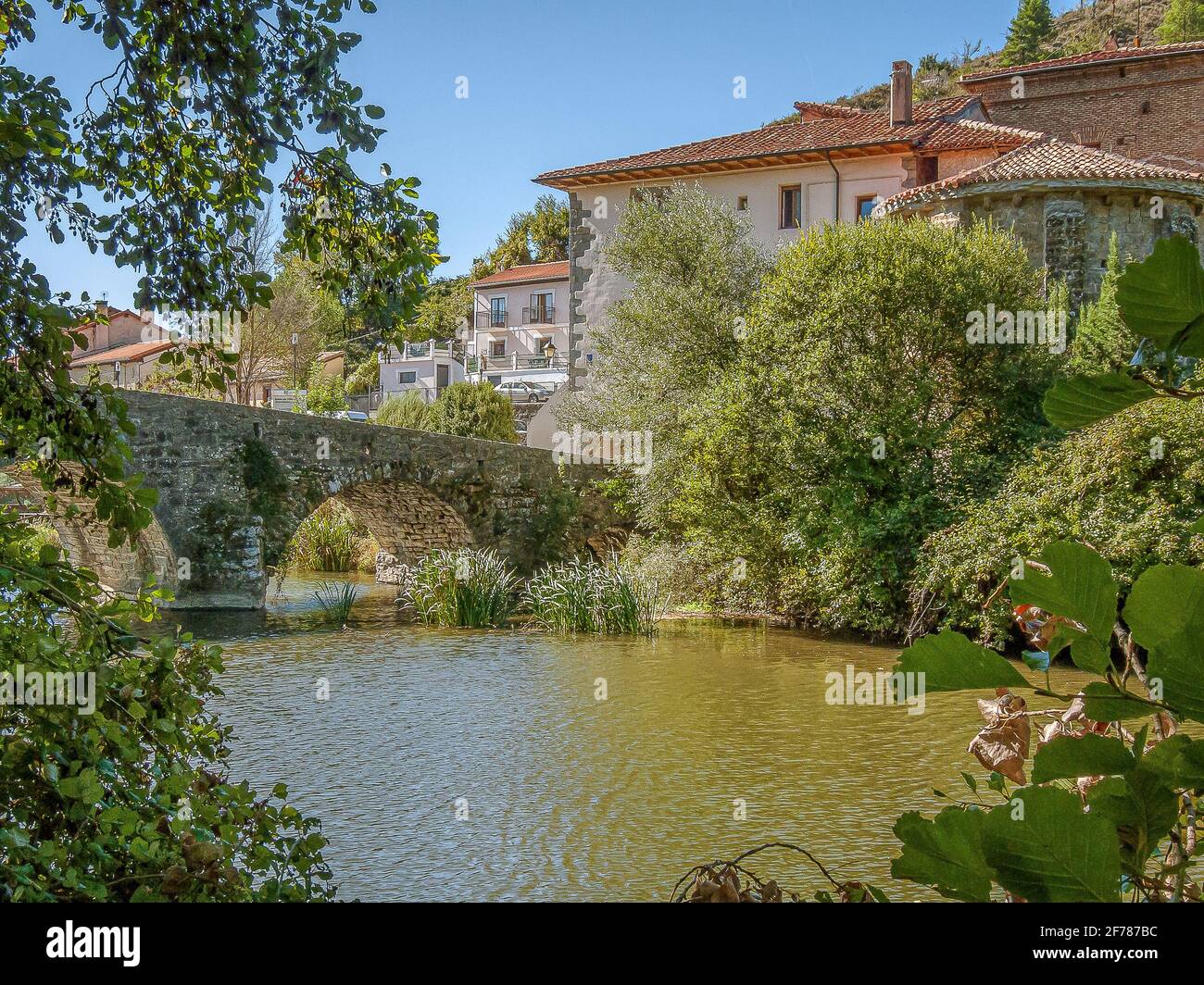 The albergue at La Trinidad de Arre and the medieval bridge over Rio ...