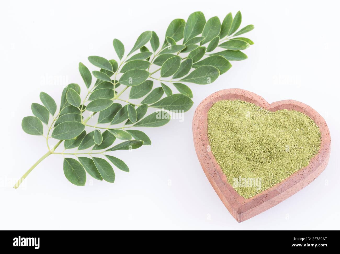 Fresh leaves and moringa powder - Moringa oleifera. Top view Stock ...