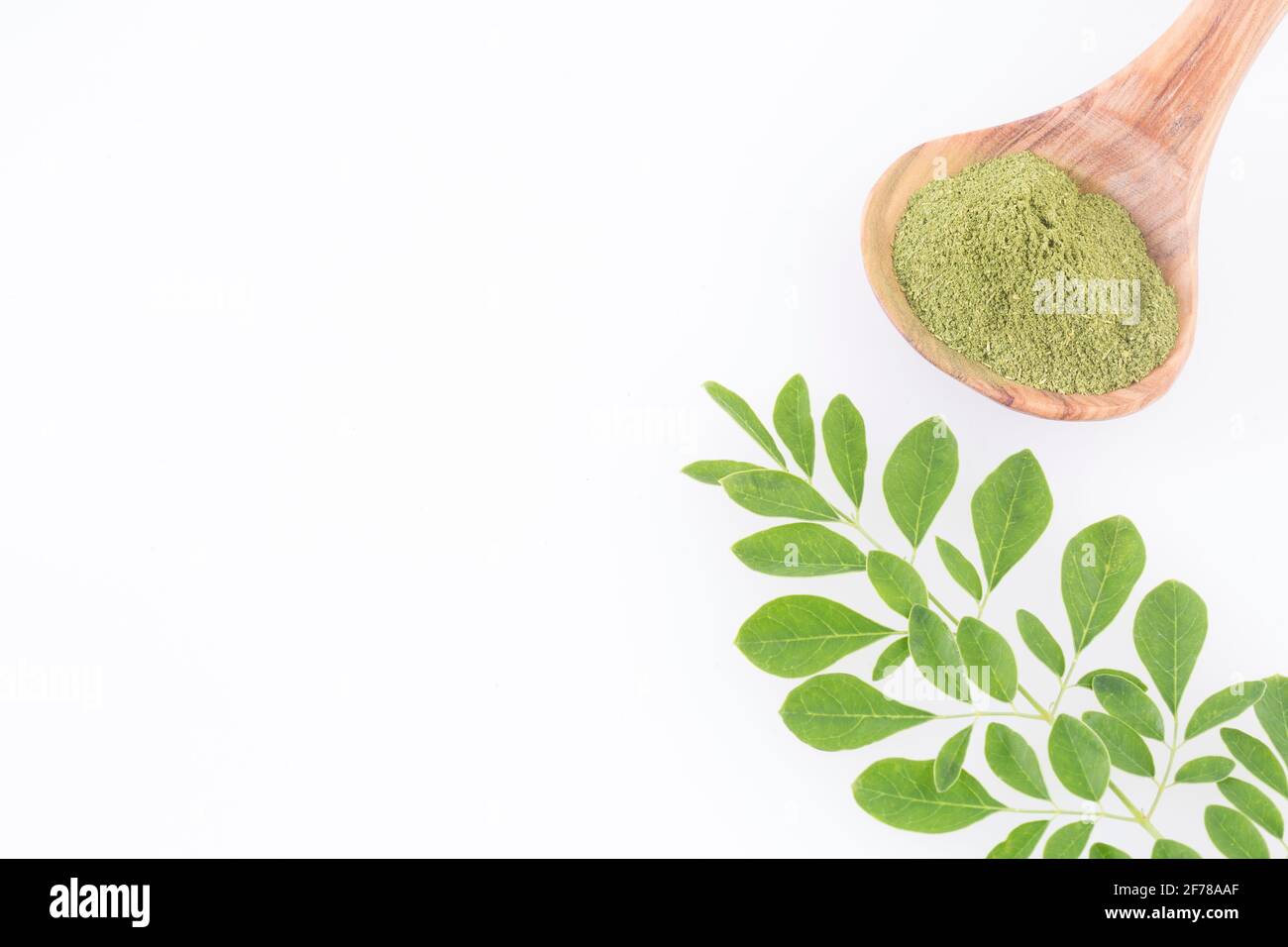 Fresh leaves and moringa powder - Moringa oleifera. Top view Stock ...