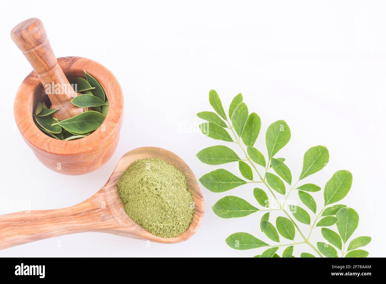 Fresh leaves and moringa powder - Moringa oleifera. Top view Stock ...