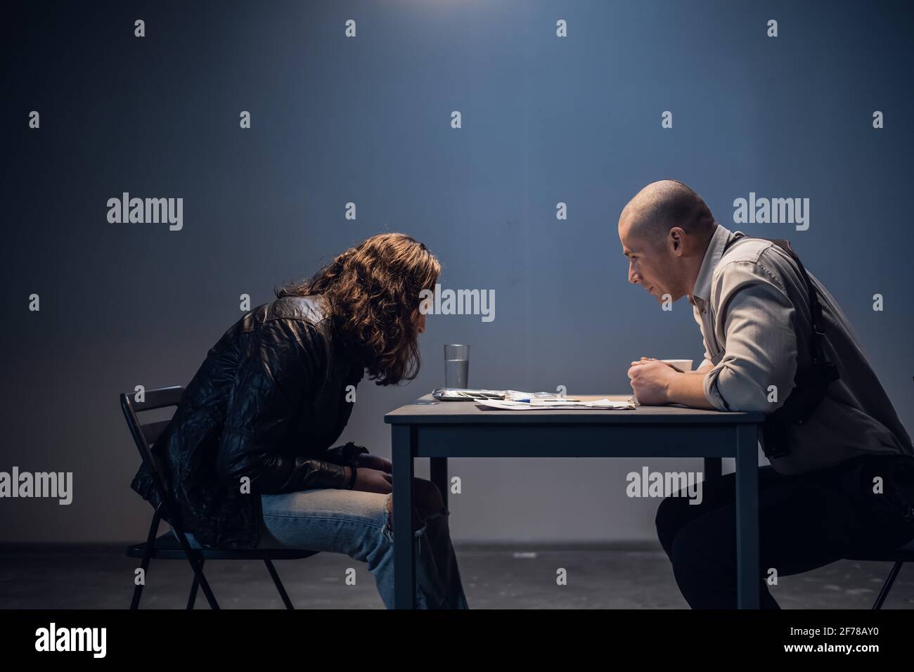 A police detective suspects a white man of committing a crime. Conducts ...