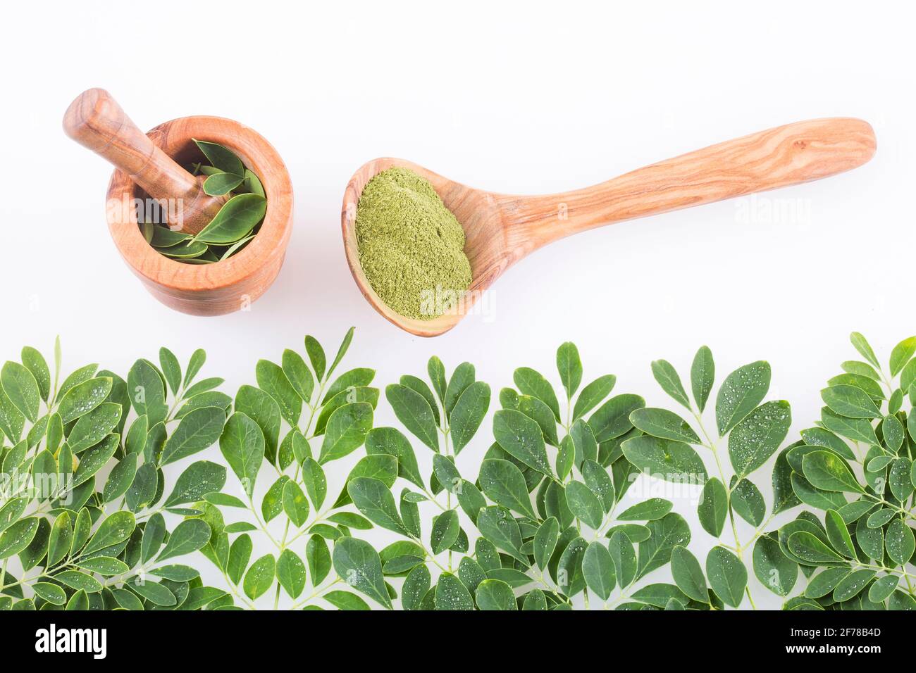 Fresh leaves and moringa powder - Moringa oleifera. Top view Stock ...