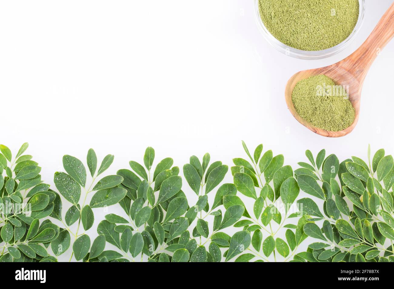 Fresh leaves and moringa powder - Moringa oleifera. Top view Stock ...