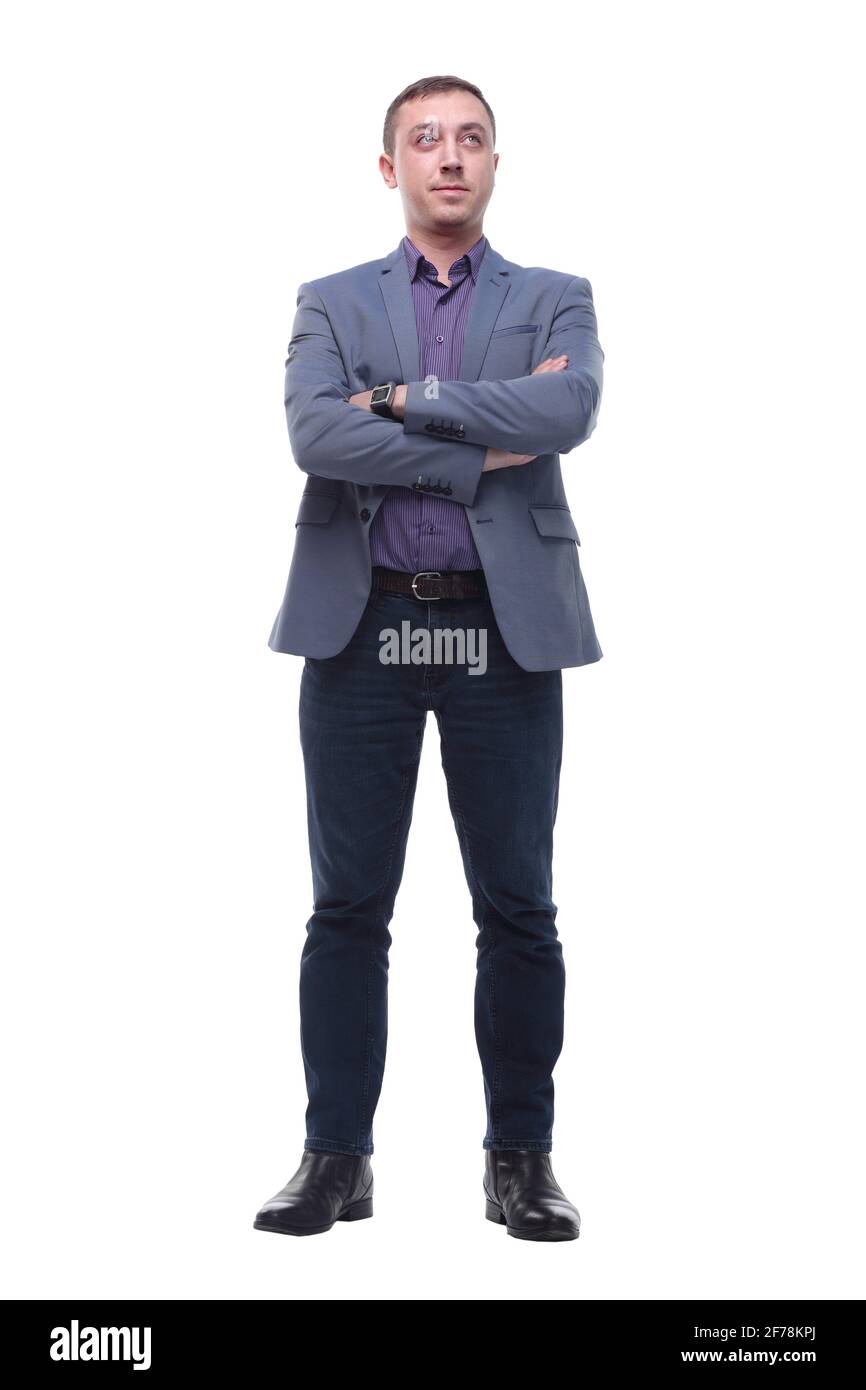 Smiling businessman standing with arms folded isolated on a white ...