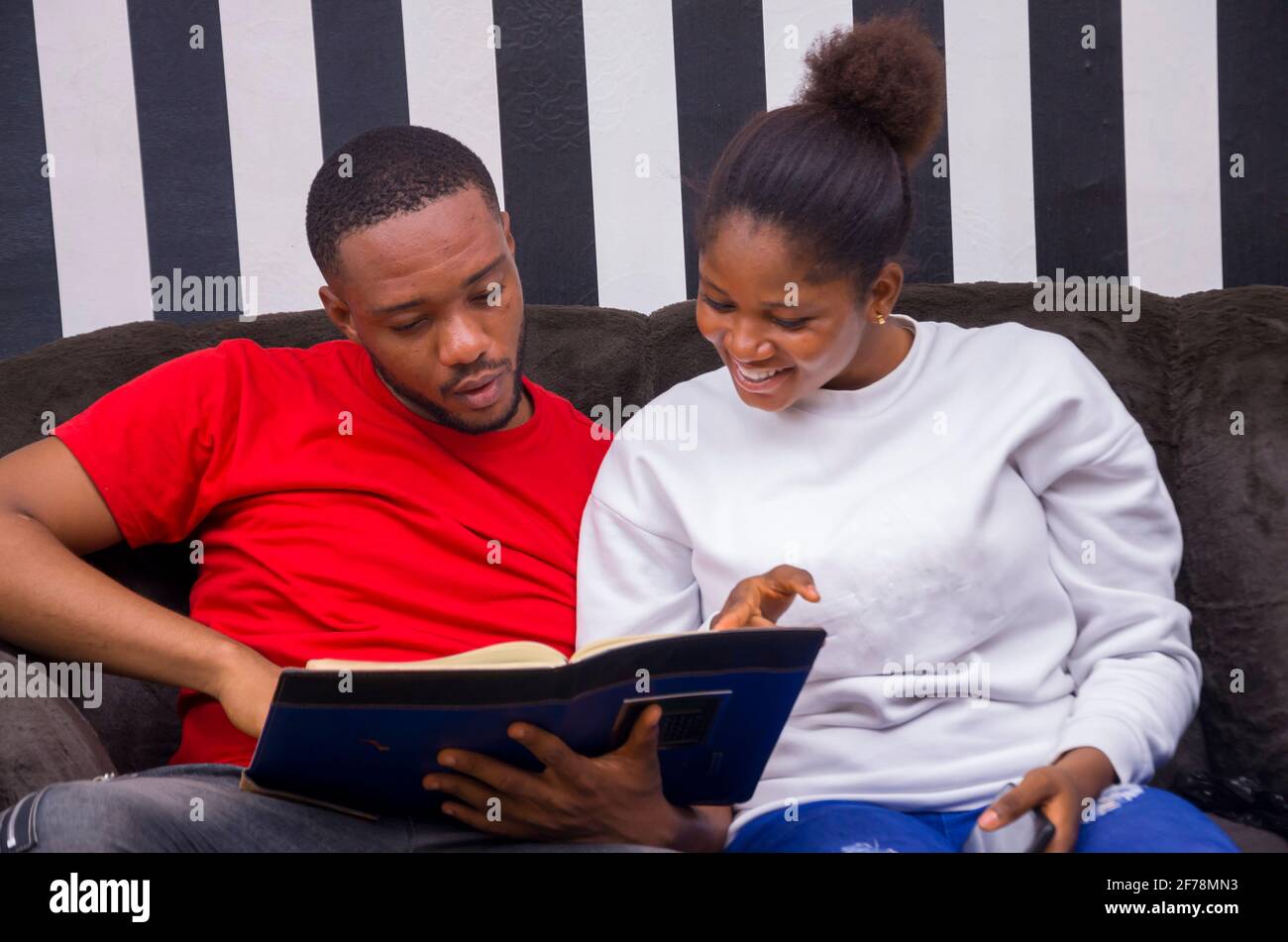 two african student studying their books Stock Photo - Alamy
