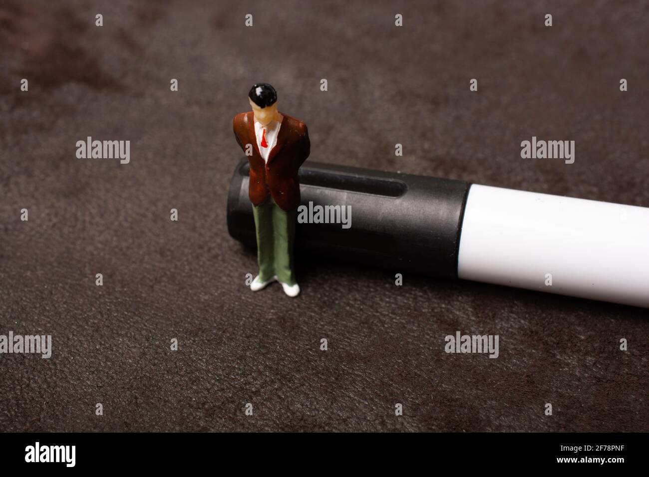 Little tiny man person figurine in view Stock Photo - Alamy