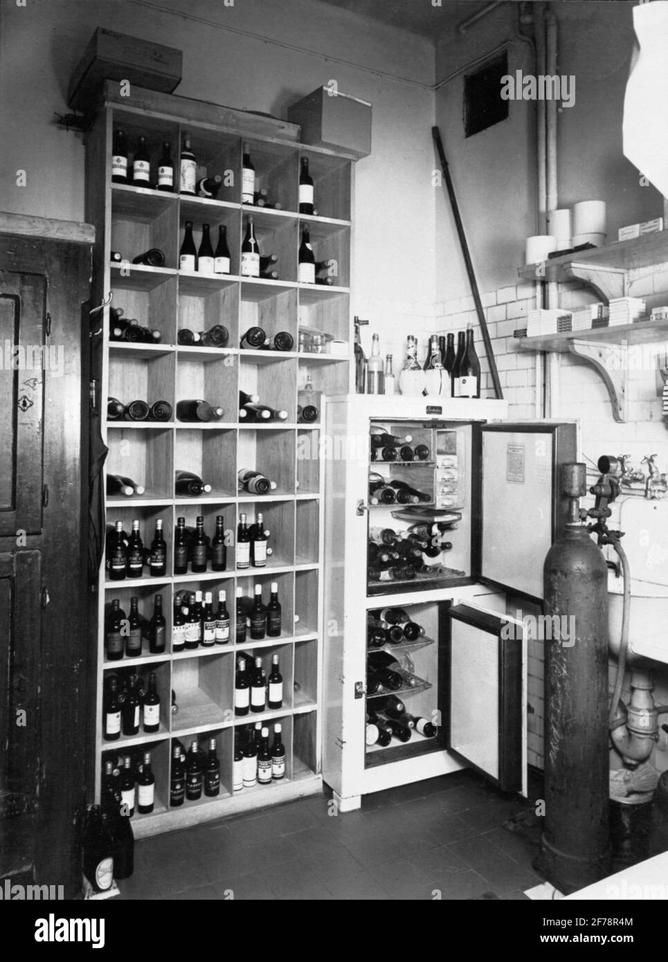 Designation: K8. 2 refrigerator in a casing, open, with bottles ...