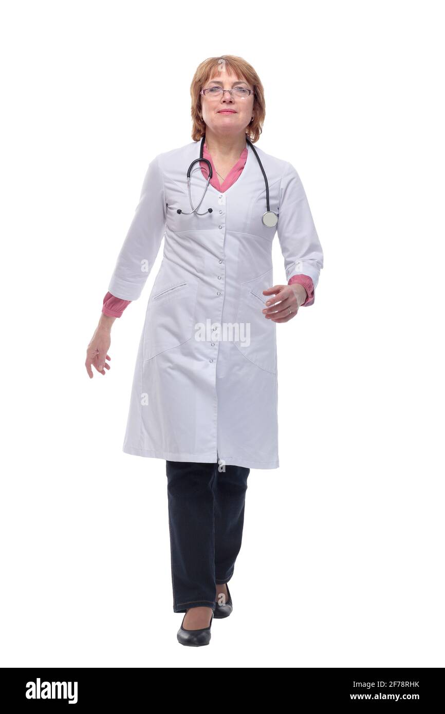 Female doctor walking towards the camera smiling Stock Photo - Alamy