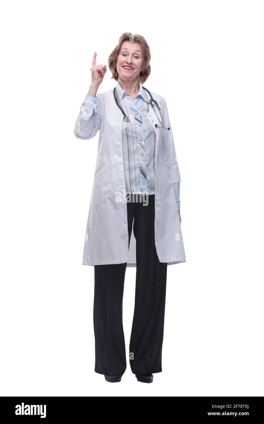 Portrait of a senior woman wearing doctor uniform and pointing up with ...