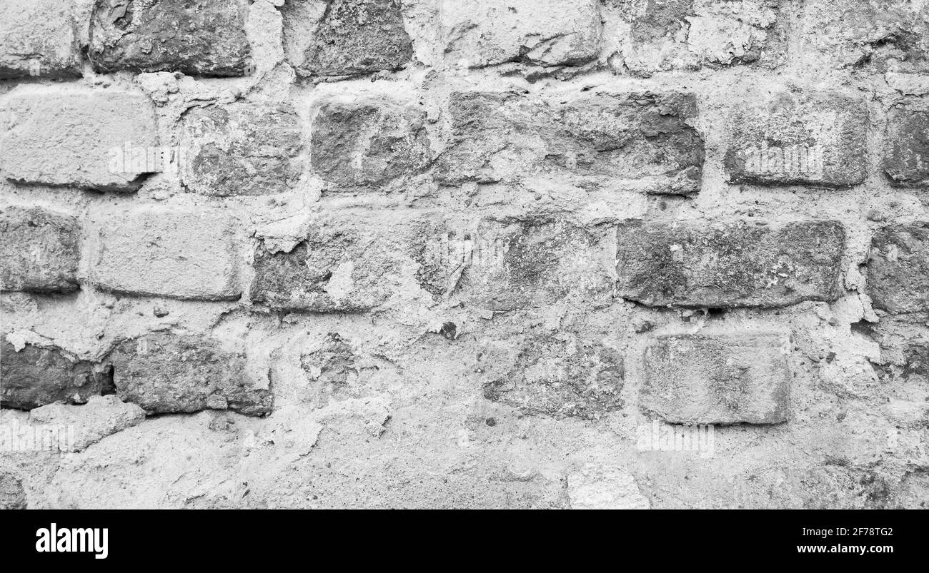 Gray brick wall background, old brick wall partly covered by concrete ... Gray brick wall background, old brick wall partly covered by concrete ...