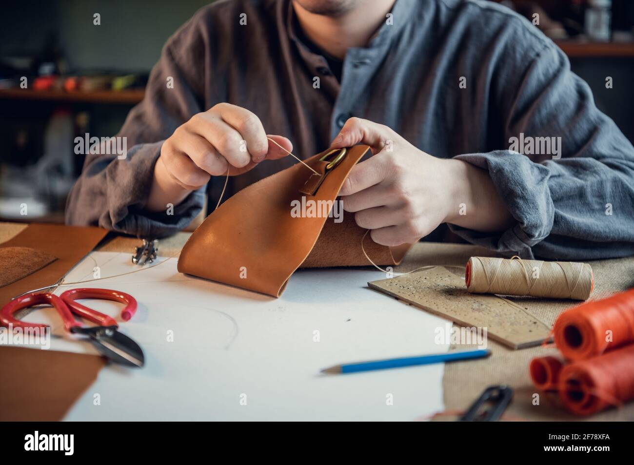 Desktop in the shoemaker workshop. The process of making leather shoes ...