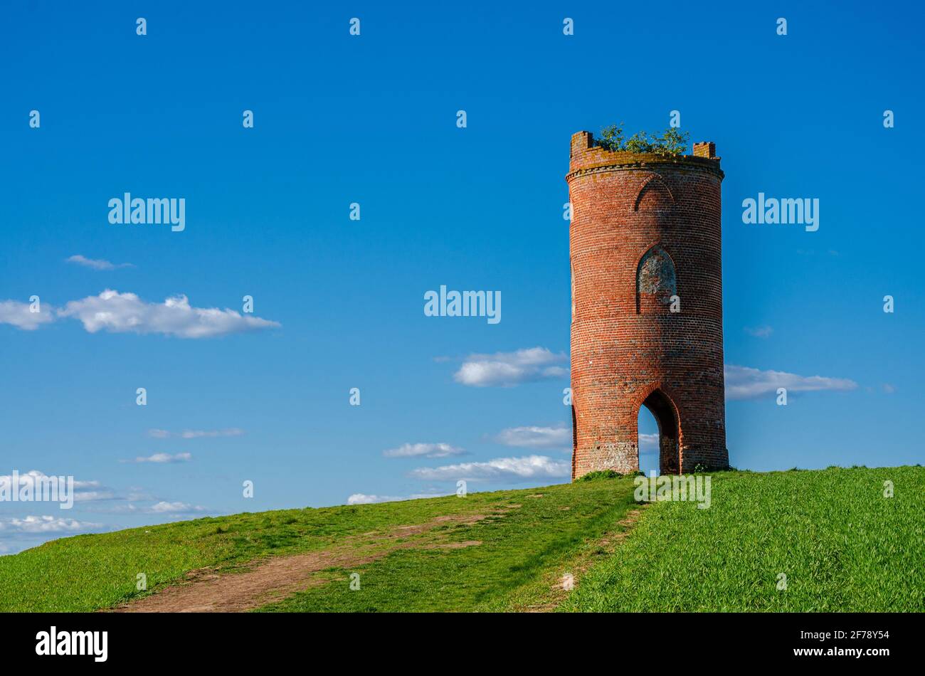 Wilder's Folly, a brick built structure, stands in a green field ...