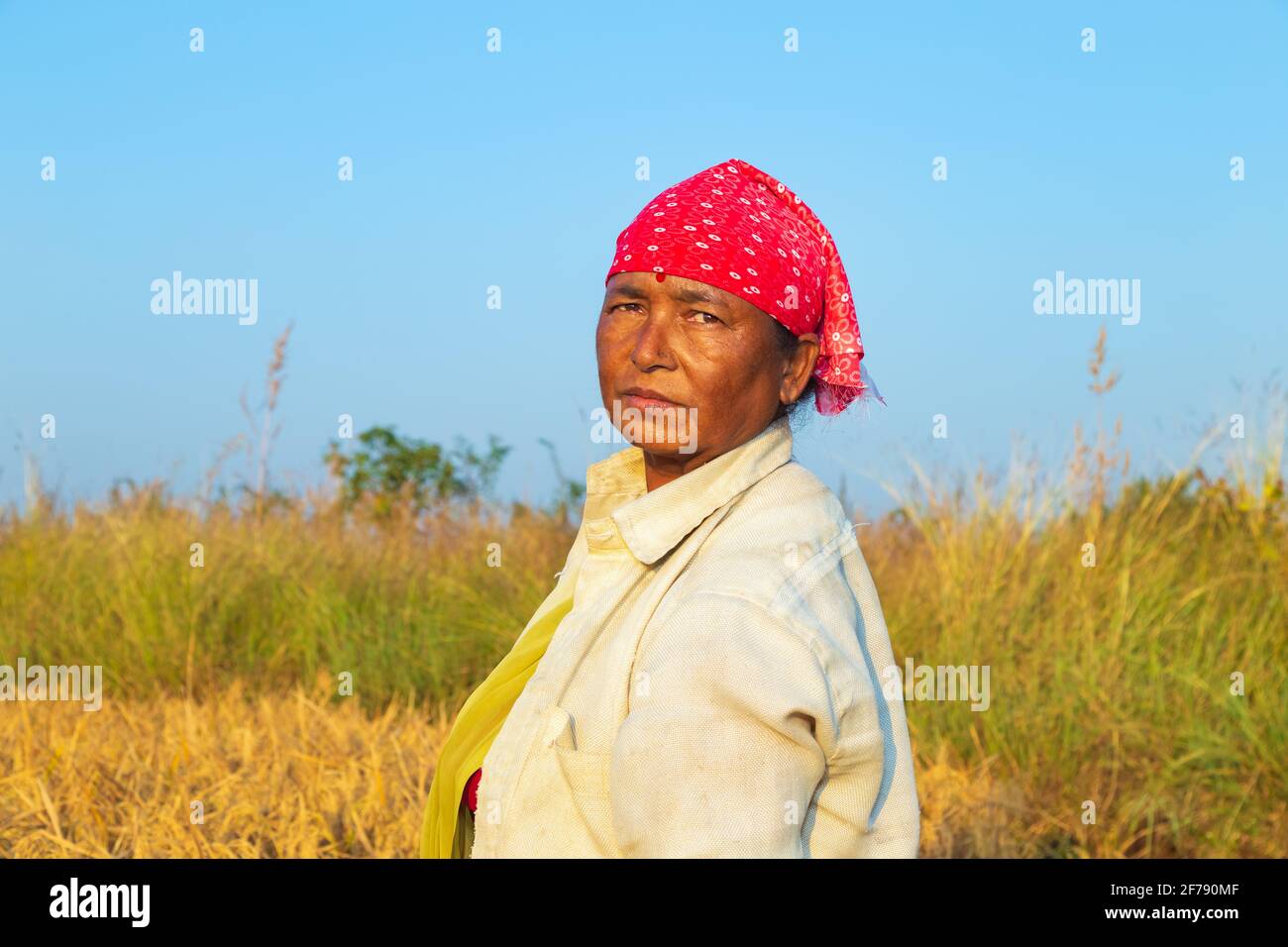 A woman after a long day of work in the field, looking tired, exhausted ...