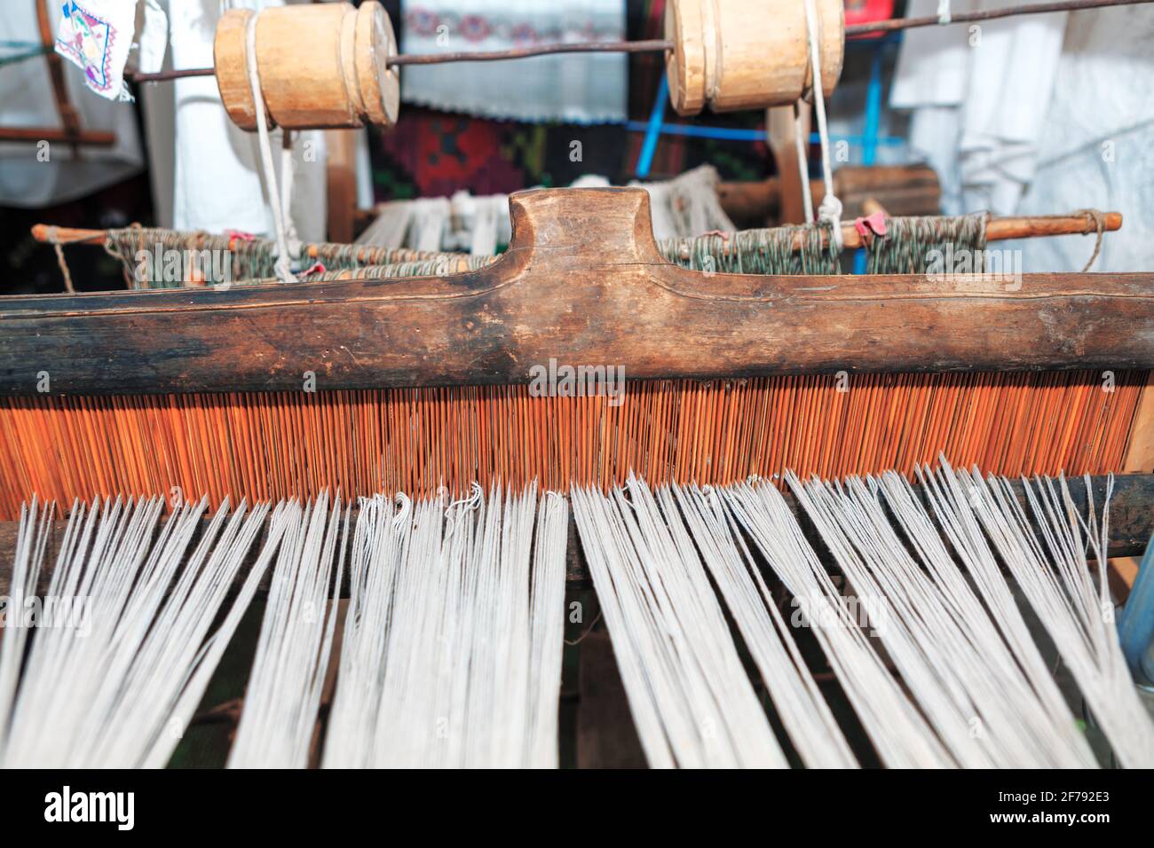 Ancient loom for making carpets . Manufacturing of weaving cloth and ...
