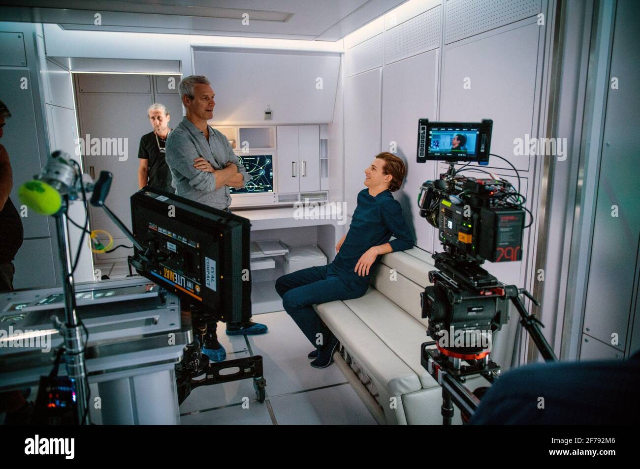 VOYAGERS, front, from left: director Neil Burger, Tye Sheridan, on set ...