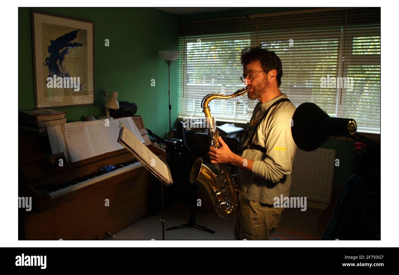 Tim Whitehead plays the sax at his home in Ham, Richmond.pic David ...
