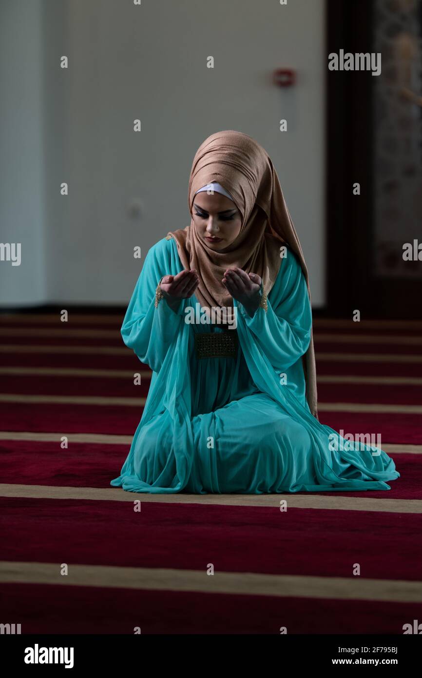Humble Muslim Woman Is Praying in the Mosque Stock Photo - Alamy