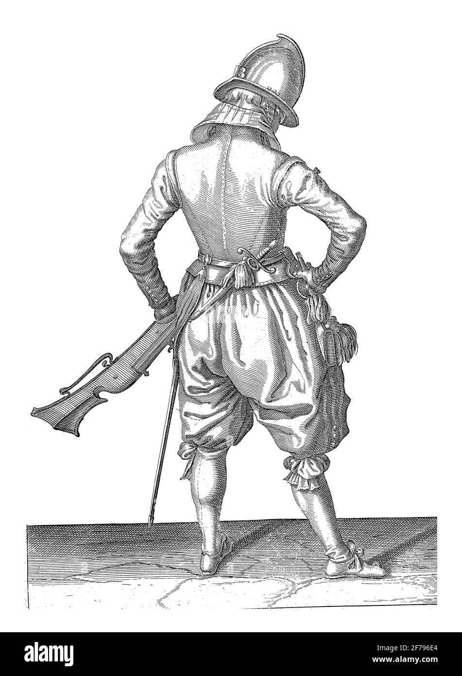 A soldier, full-length, seen from the back, who with his left hand is ...