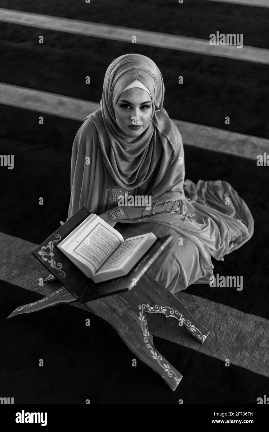 Young Traditional Muslim Woman Reading Quran in the Mosque Stock Photo ...