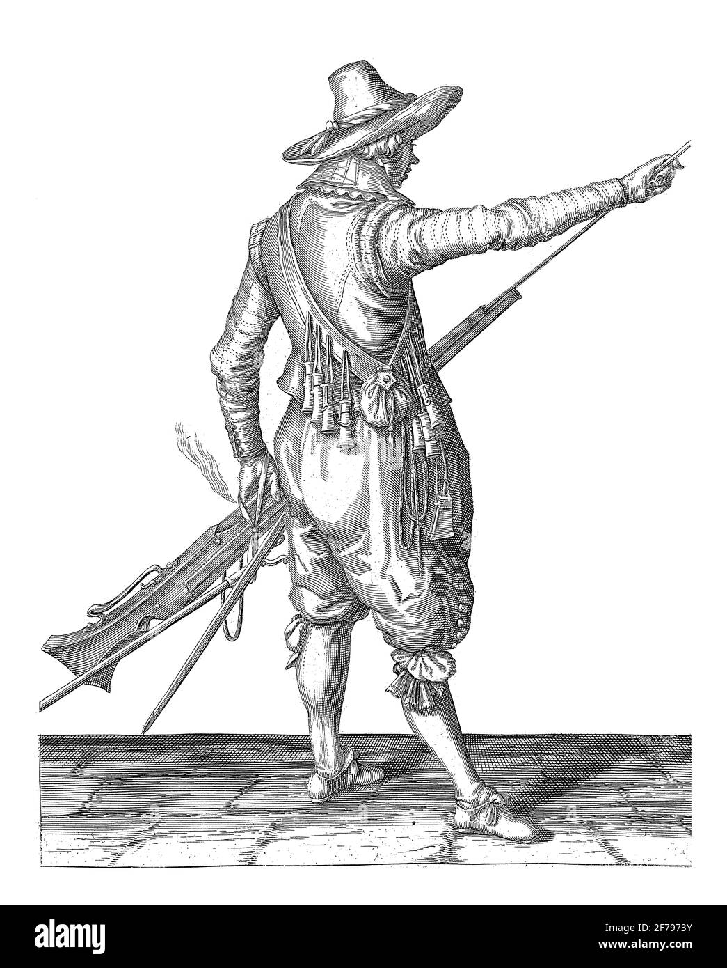 A soldier, seen to the right, seen from the back, holding a musket with ...