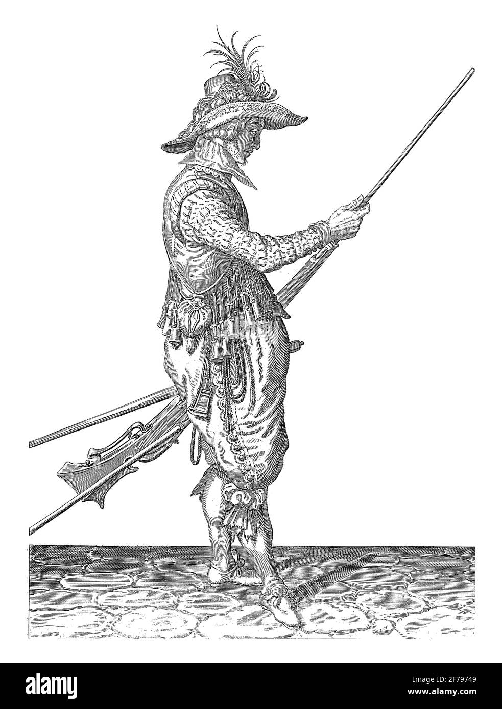 A soldier, to the right, holding a musket with his left thigh with his ...