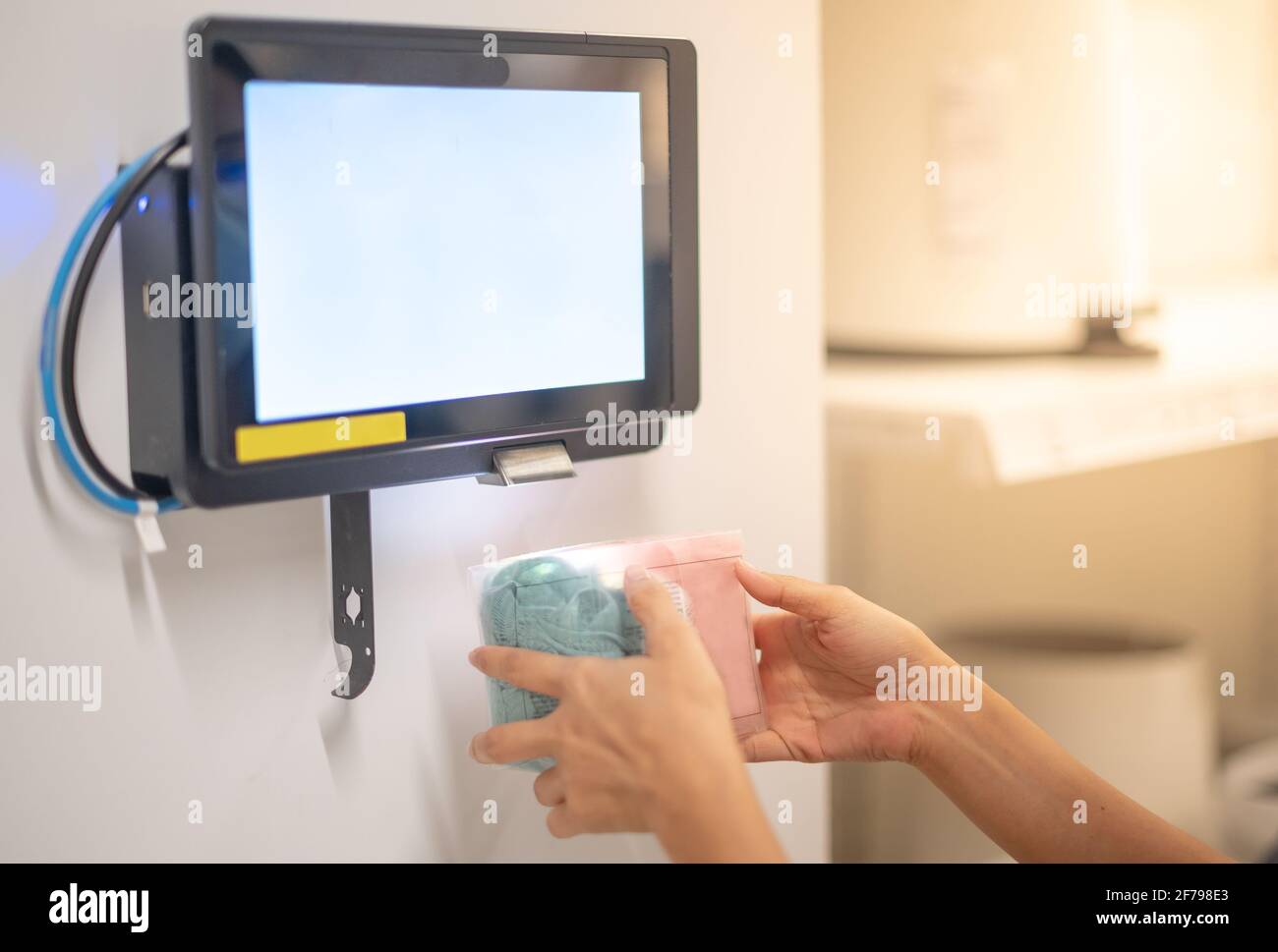Female hand holding goods scanning barcode on information machine for ...