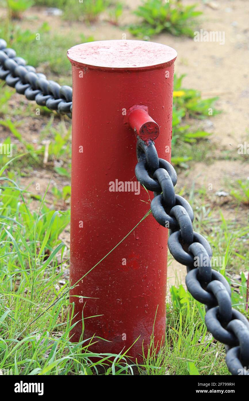 A vertical photo of a red chain link fence Stock Photo - Alamy